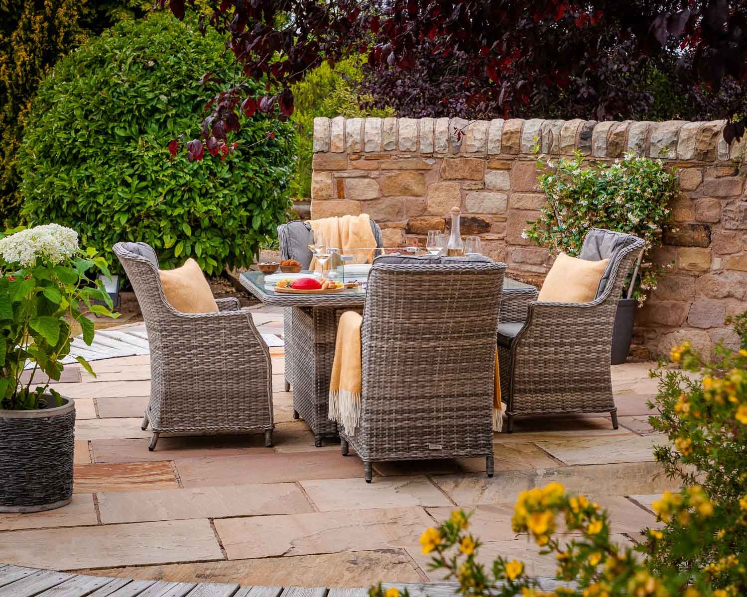 Riviera 4 Rattan Garden Chairs and Square Fire Pit Dining Table in Grey Rattan Direct